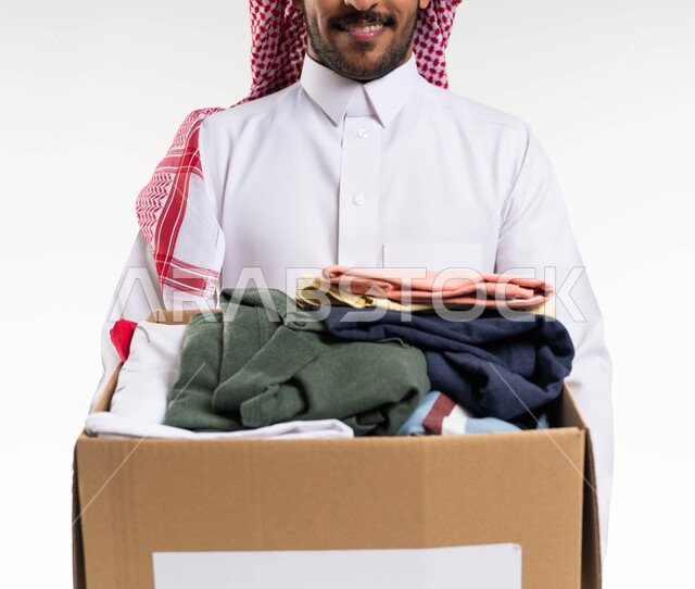 Giving Eid clothes to the needy, a portrait of a Saudi Arabian Gulf man ...
