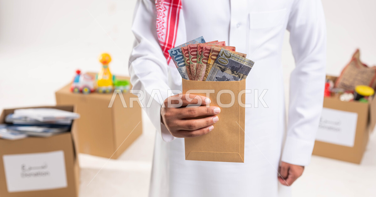 Giving out zakat money to the needy, Islamic charities in Saudi Arabia ...