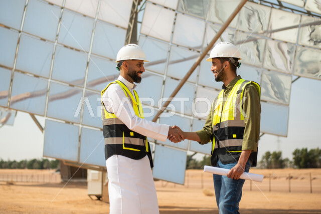 Two Saudi Arabian Gulf engineers supervising solar power plants ...