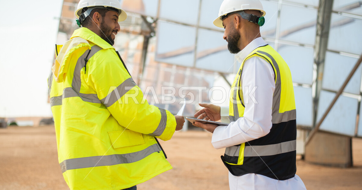 Two Saudi Arabian Gulf engineers supervising solar power plants ...