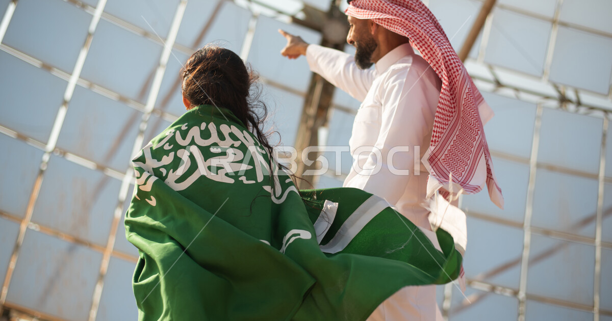 A picture from the back of a girl putting the flag of the Kingdom of ...
