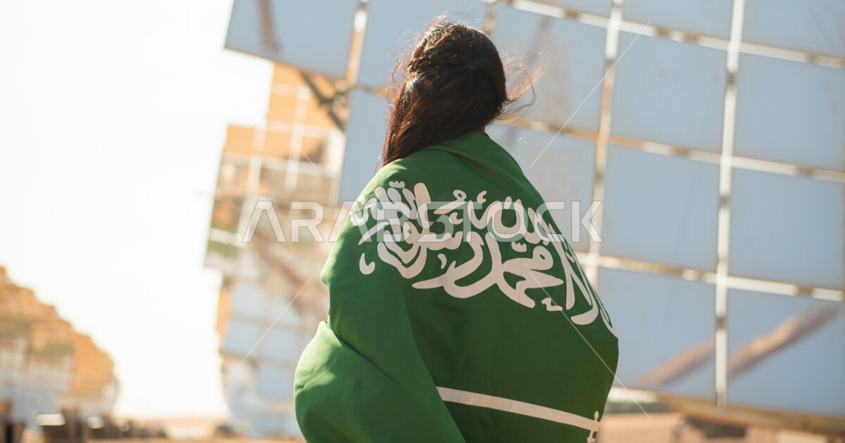 A picture from the back of a girl putting the flag of the Kingdom of ...