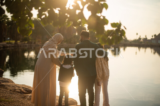 A Saudi Gulf Arab family outdoors, a fishing trip, recreational ...