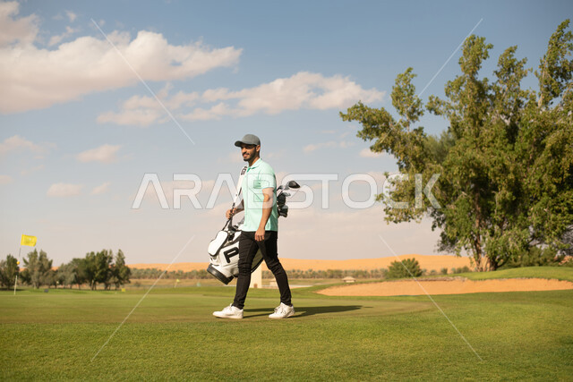 Golf course, a Saudi Arab Gulf man wearing a sports uniform and ...