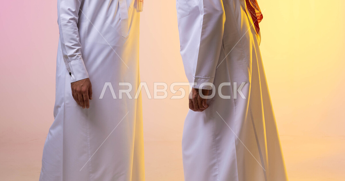 Portrait of a Saudi Arab Gulf man kissing his father's head, full ...