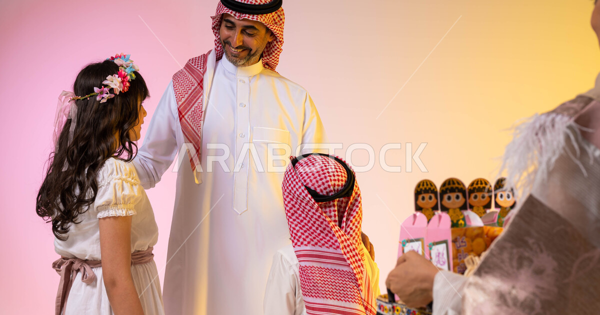 Portrait of a Saudi Arabian Gulf family celebrating Eid days, happy ...