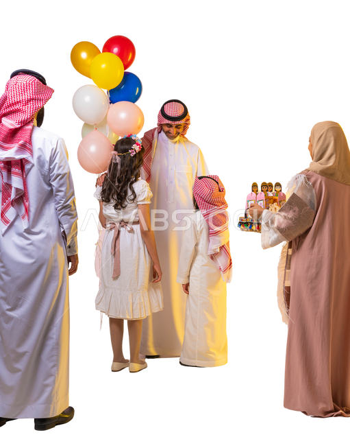 Portrait of a Saudi Arabian Gulf family celebrating the days of Eid, a ...