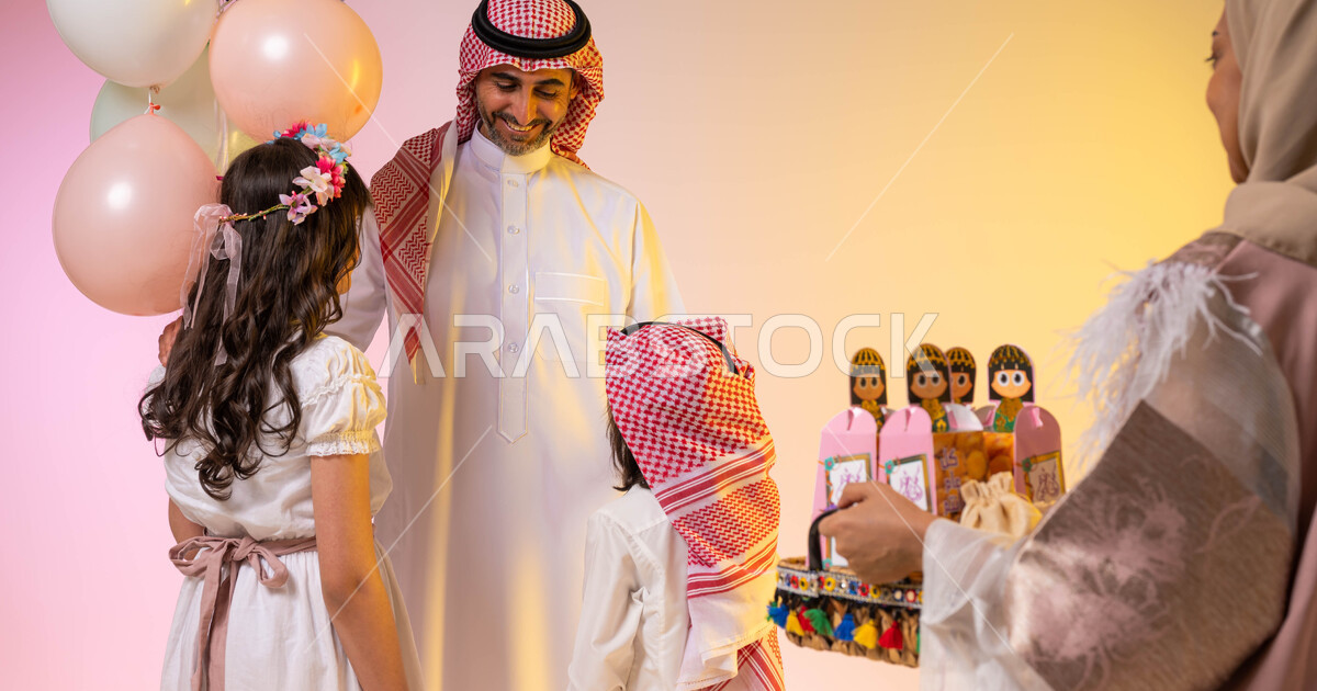 Portrait of a Saudi Arabian Gulf family celebrating Eid days, happy ...