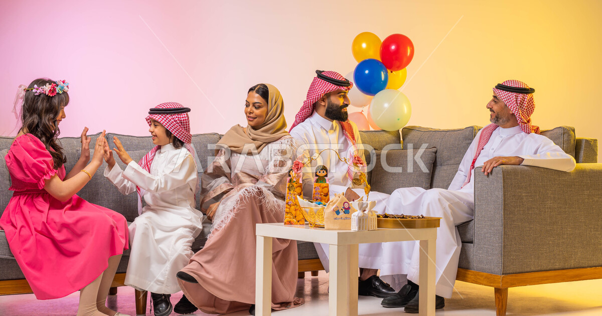 Portrait of a Saudi Arabian Gulf family celebrating the advent of the ...
