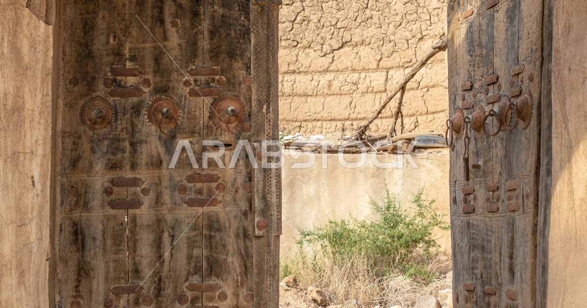 A close-up of the doors of mud houses in Asir, Saudi Arabia, old ...