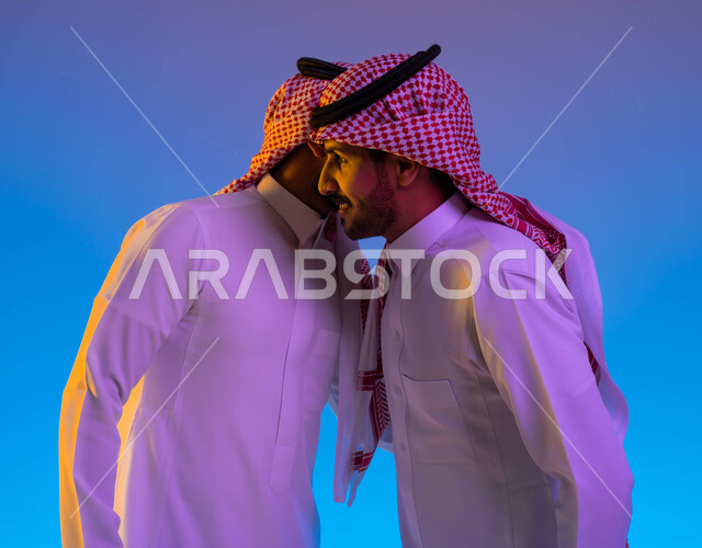 Two Saudi Arabian Gulf men shaking hands warmly, Eid atmosphere, Eid ...