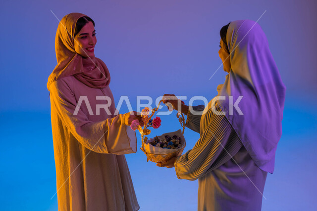 Portrait of two Saudi Arabian Gulf women, celebrating the happy Eid ...