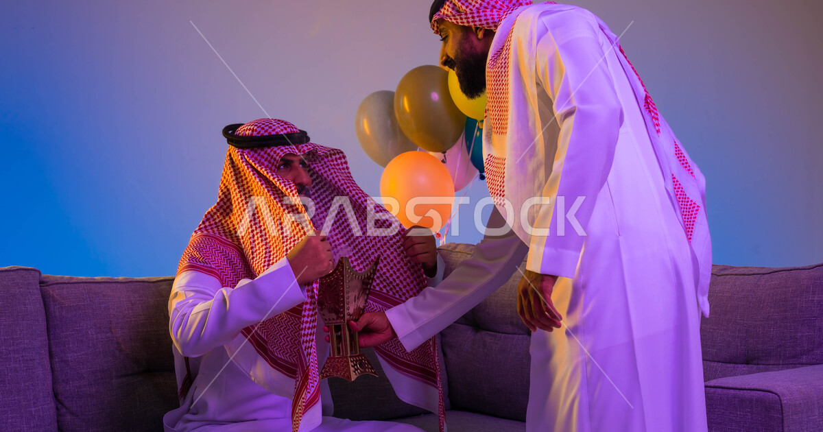 Two Saudi Arabian Gulf men using incense burners, the use of oud wood ...