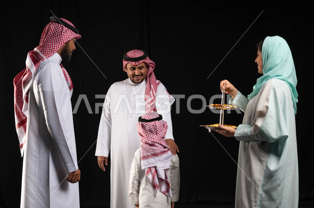 Portrait of two Saudi Arabian Gulf men wearing traditional Saudi dress ...