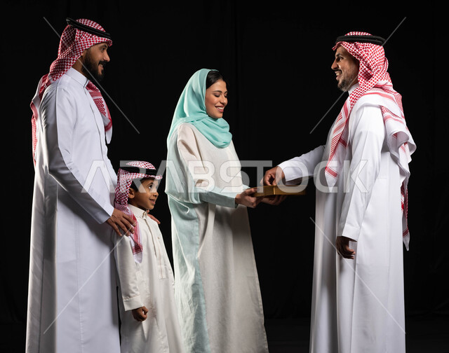 Portrait of a Saudi Arab Gulf family, offering hospitality and Eid ...