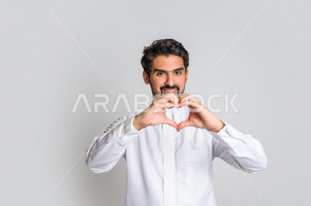 Portrait of a Saudi Arabian Gulf man wearing the Saudi dress, hand ...