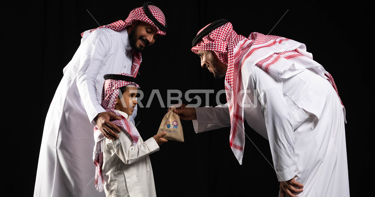 Presenting Eidiya for children, a portrait of a young Saudi Arabian ...