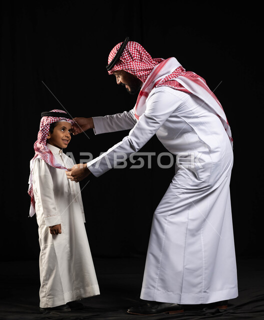 Portrait of a Saudi Arab Gulf youth wearing the Saudi dress and shemagh ...