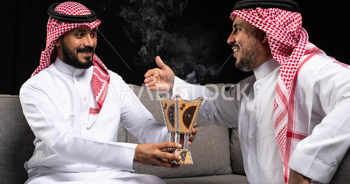 Portrait of two Saudi Arab Gulf men wearing the traditional Saudi dress ...