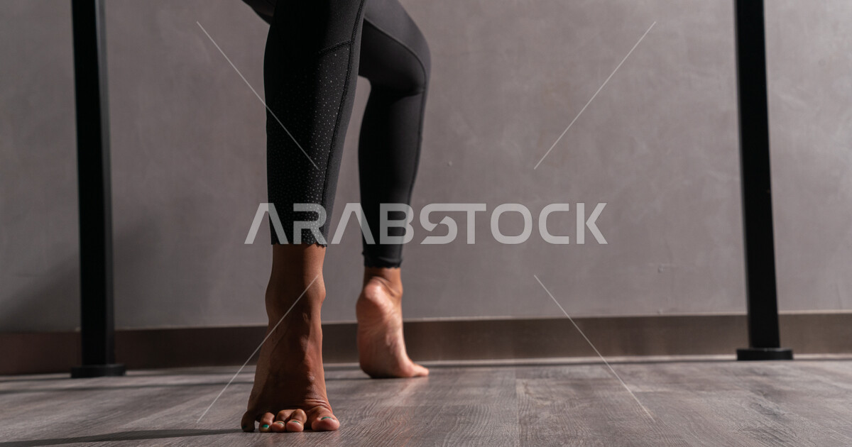A picture from the back of a Saudi Arabian Gulf woman wearing a sports ...