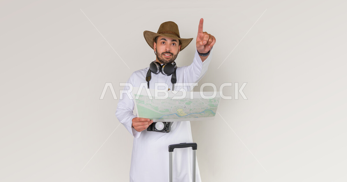 Portrait of a Saudi Arabian Gulf youth wearing a cowboy hat and ...
