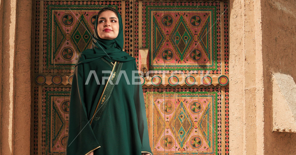 A veiled Saudi Arab Gulf woman wearing the contemporary Gulf abaya ...