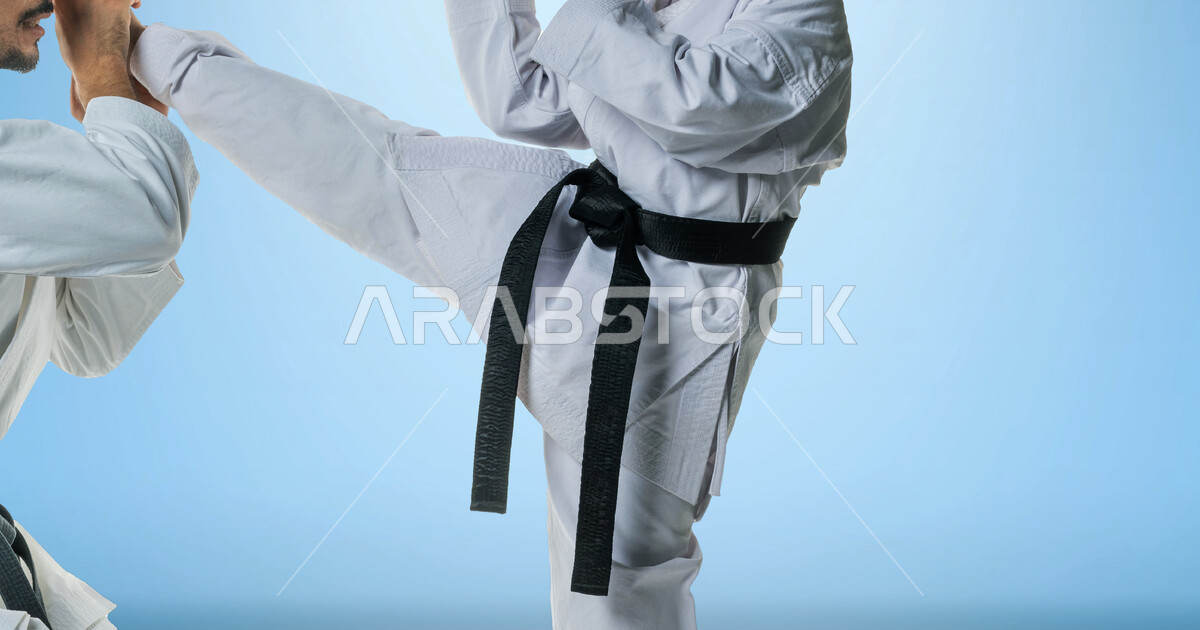 Portrait of a Saudi Arabian Gulf boy wearing a white karate uniform ...
