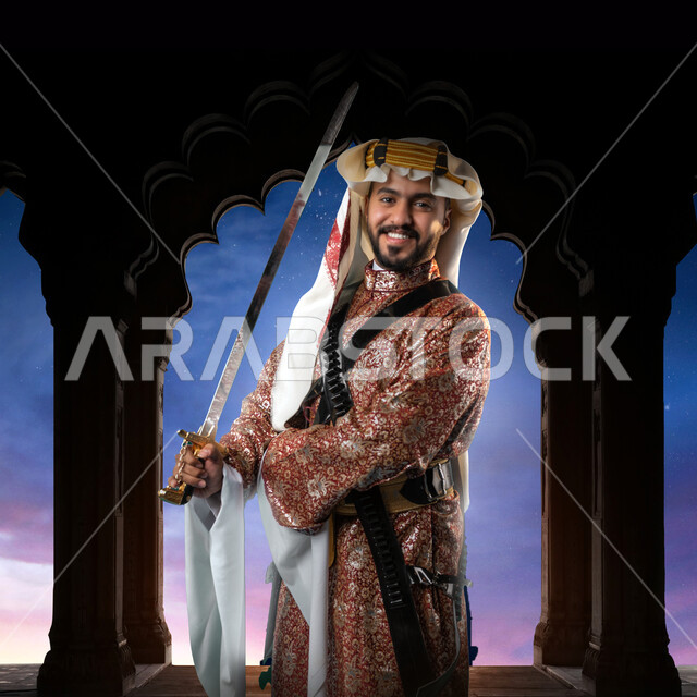 A Saudi Arabian Gulf man carries a Saudi sword and wears a traditional ...