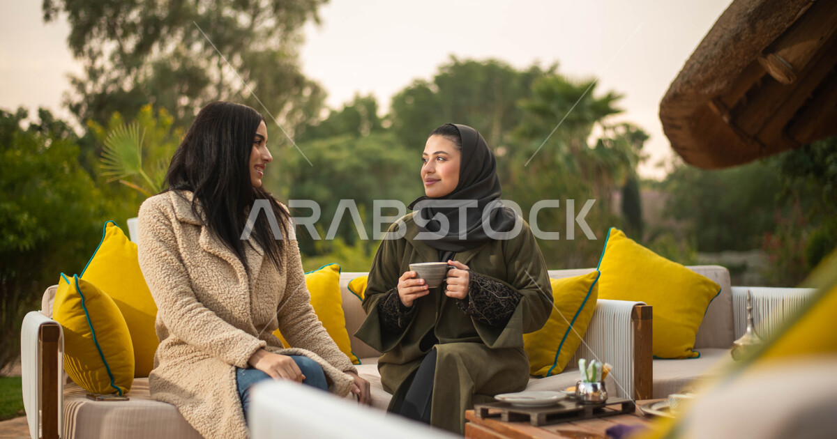 Spending fun times in the green nature and sitting in the open air, two ...