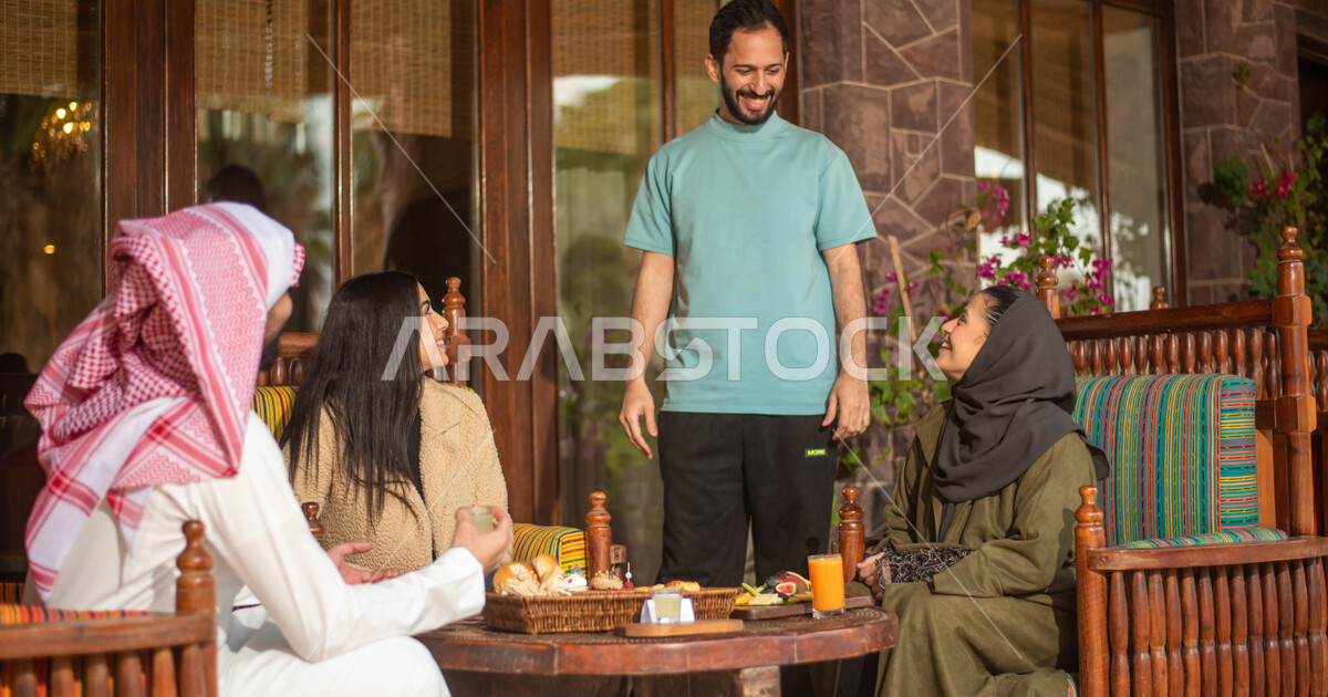 Saudi Arabian Gulf owners enjoying an exchange of conversation in a ...