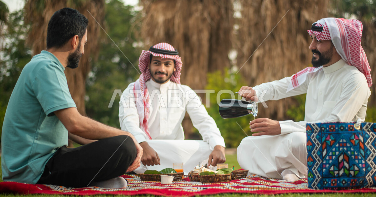 A youthful atmosphere in a Saudi park, Saudi Gulf Arab friends enjoying ...