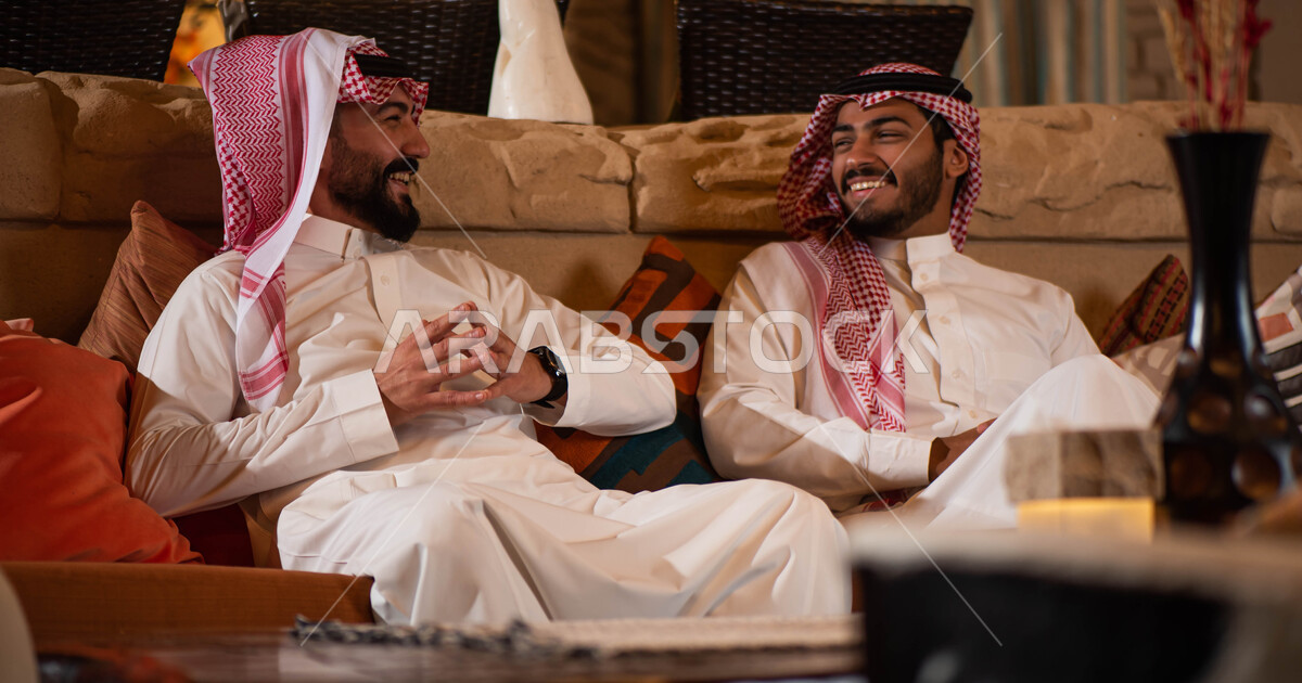 A happy Saudi session, two Saudi Arabian Gulf men dressed in ...