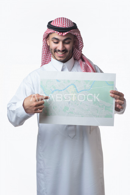Portrait of a young Saudi Arabian Gulf Arab tour guide wearing ...