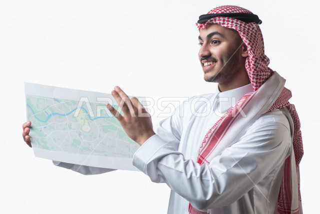 Portrait of a young Saudi Arabian Gulf Arab tour guide wearing ...