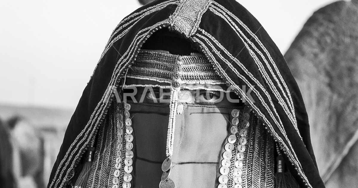 Covering and covering the face, wearing the traditional burqa, a Saudi ...