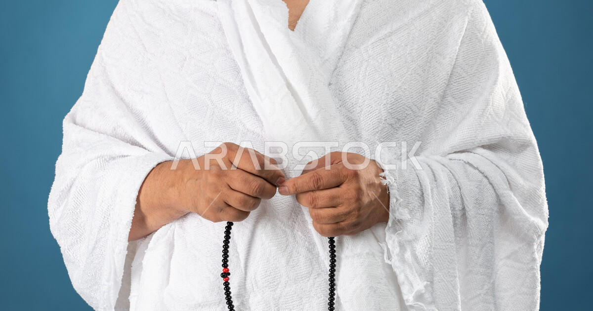 Performing the rituals of Hajj and Umrah, wearing Ihram clothes, a ...