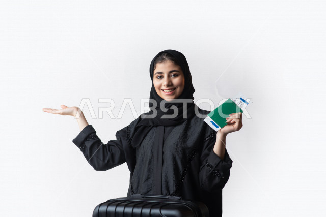 Portrait of a young Saudi Arabian Gulf tourist wearing a Saudi abaya ...