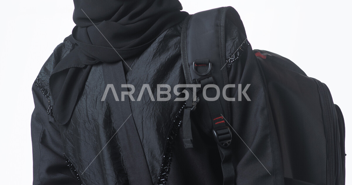 Portrait of a young Saudi Arabian Gulf tourist wearing a Saudi abaya ...