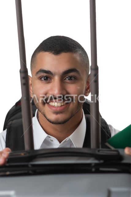 Close-up of a young Saudi Arabian Gulf Arab tourist wearing a backpack ...