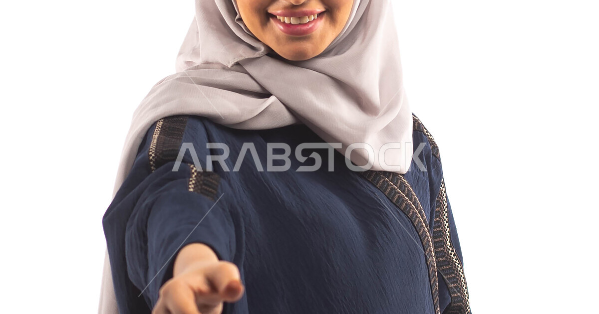 Giving greetings and peace, a portrait of a veiled Saudi Gulf Arab ...