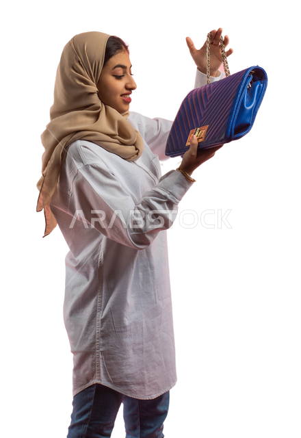 Online shopping and purchasing, a portrait of a young Saudi Arabian ...