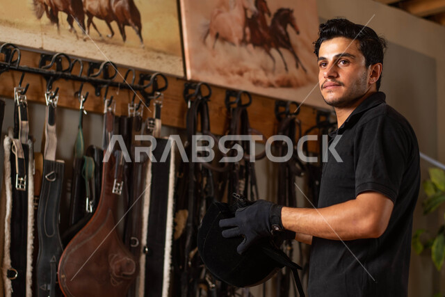 Arranging and organizing equestrian supplies, a close-up of a room for ...