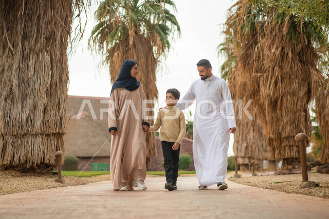 Walking and wandering in a happy family atmosphere in the green nature ...