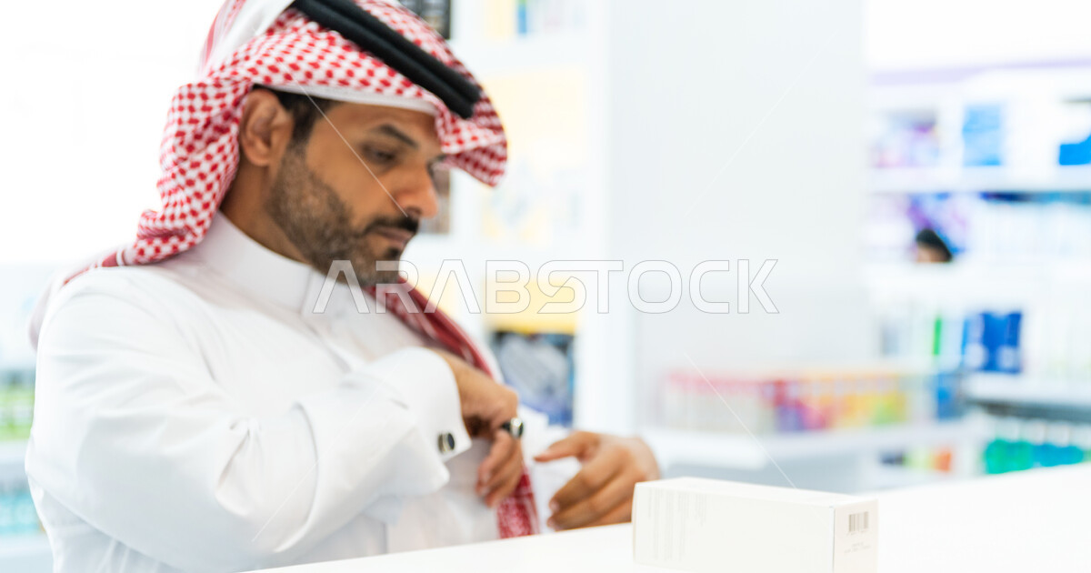 A Saudi Arabian Gulf man inside the pharmacy, describing the required ...