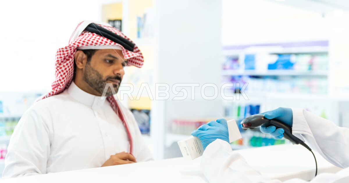 A Saudi Arabian Gulf man inside the pharmacy, describing the required ...