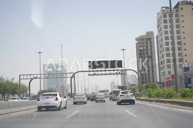 Indicative traffic signs, car traffic in the streets of Riyadh, a metal ...