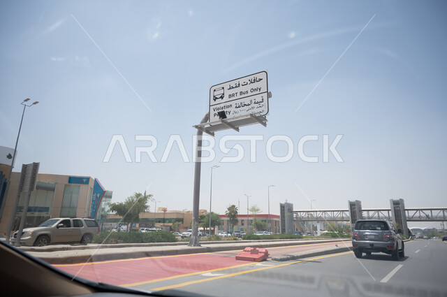 Indicative traffic signs, a road for buses only, a metal plate in the ...