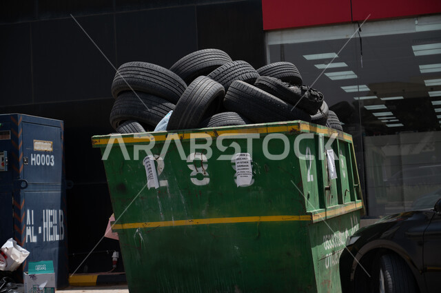 Car repair shop, recycling containers in Saudi Arabia, close-up of a ...