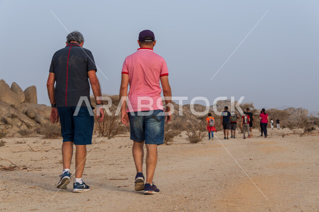 Hiking, mountain peaks and heights, a group of Saudi Gulf Arab youth ...
