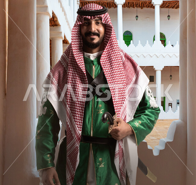 A Saudi Arab Gulf man wearing a traditional costume for national and ...